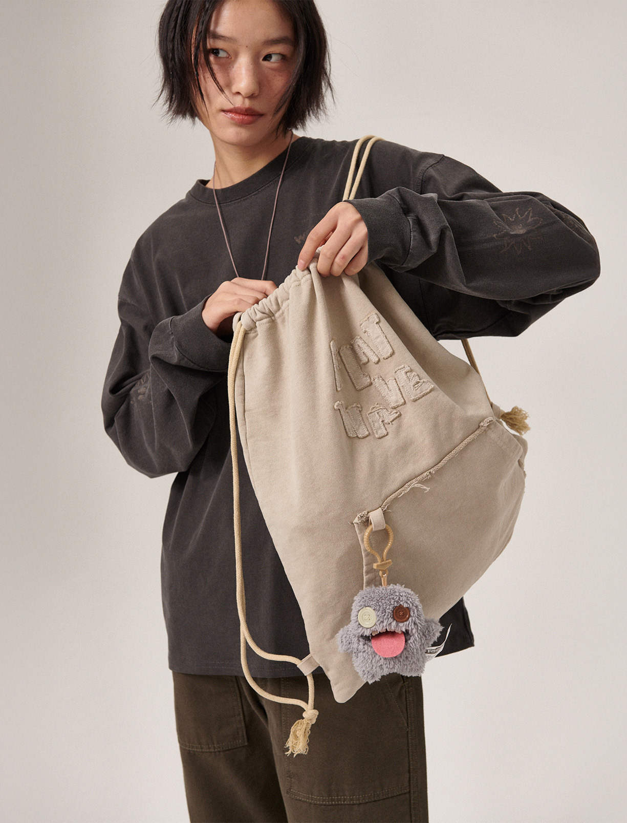 Momona Pigments String Backpack Beige - 하고(HAGO)